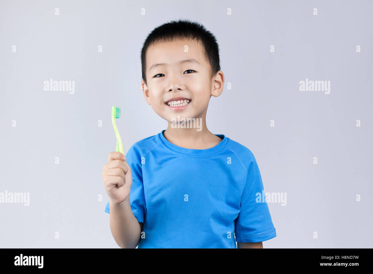 Little Chinese boy brushing teeth Stock Photo - Alamy