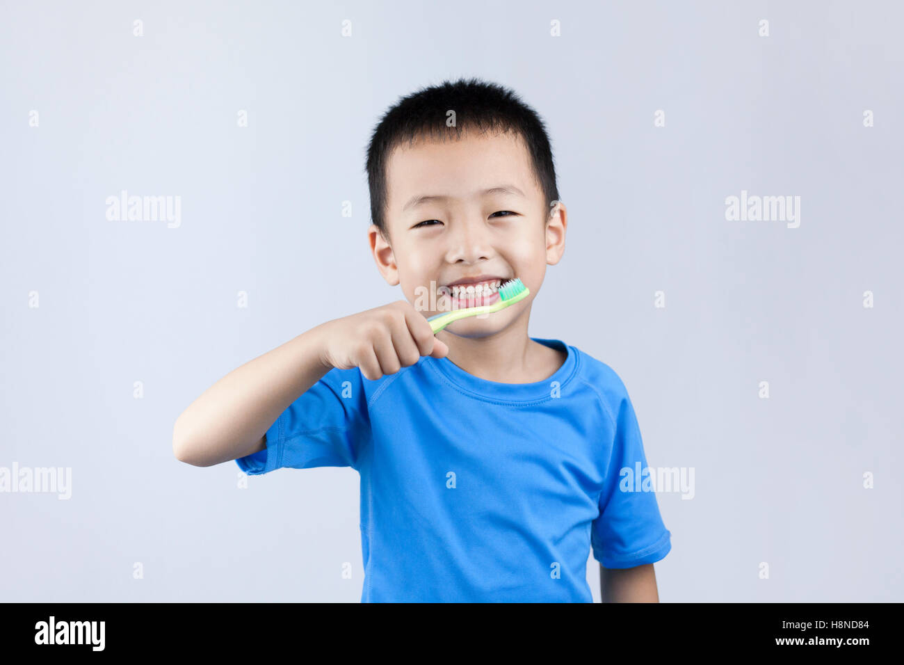 Little Chinese boy brushing teeth Stock Photo - Alamy
