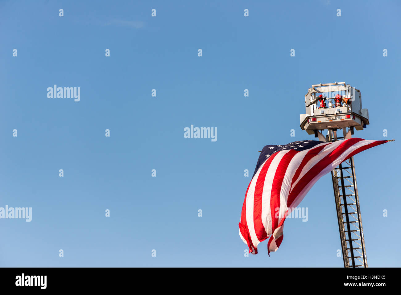 The flag of The United States of America is displayed hanging from ...
