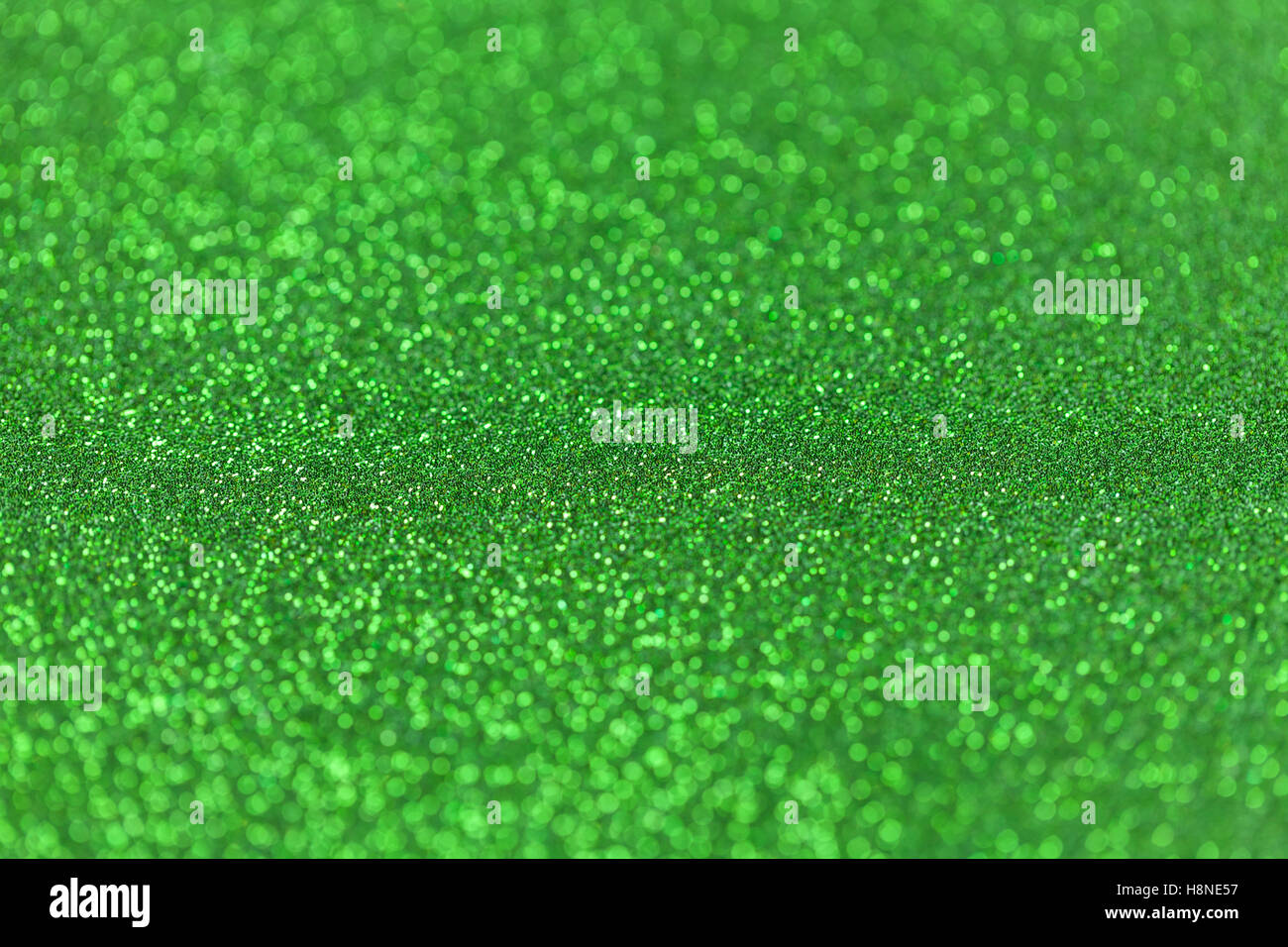 Light green sparkling background from small sequins, closeup. Brilliant ...