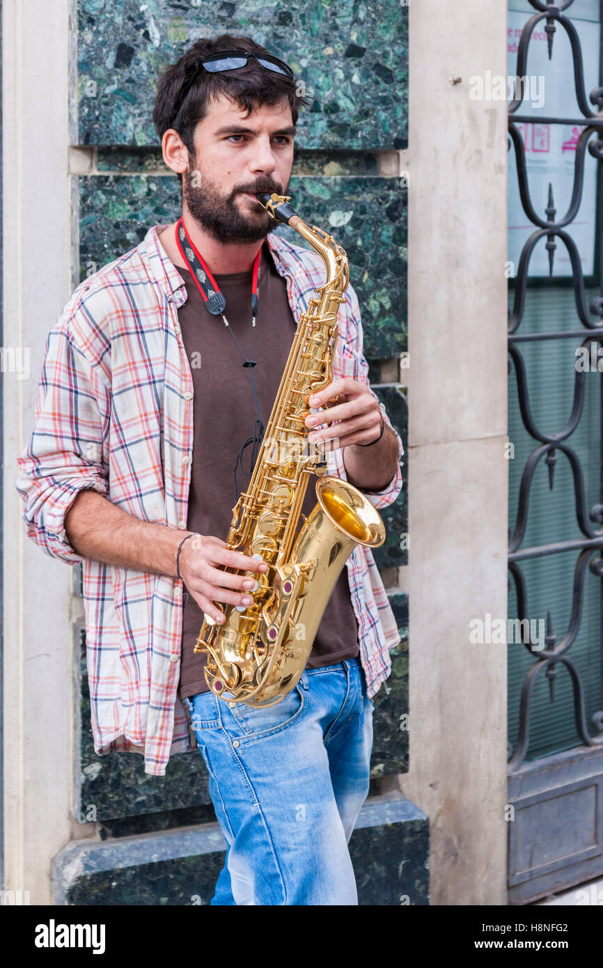Busker playing a Saxophone on Av. de la Constitución, Seville, Spain ...