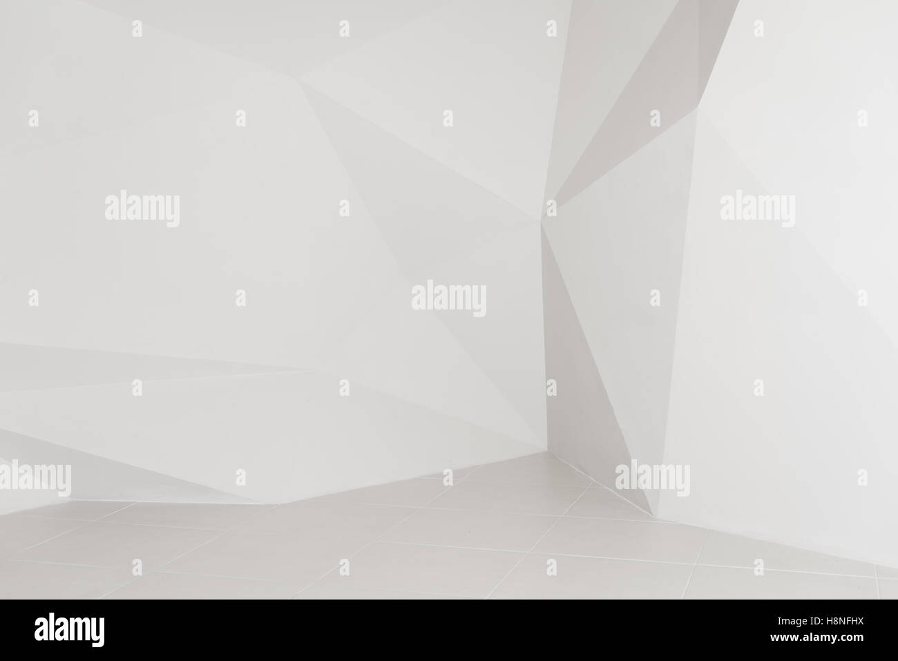 White geometric polygonal background. Walls in studio Stock Photo - Alamy