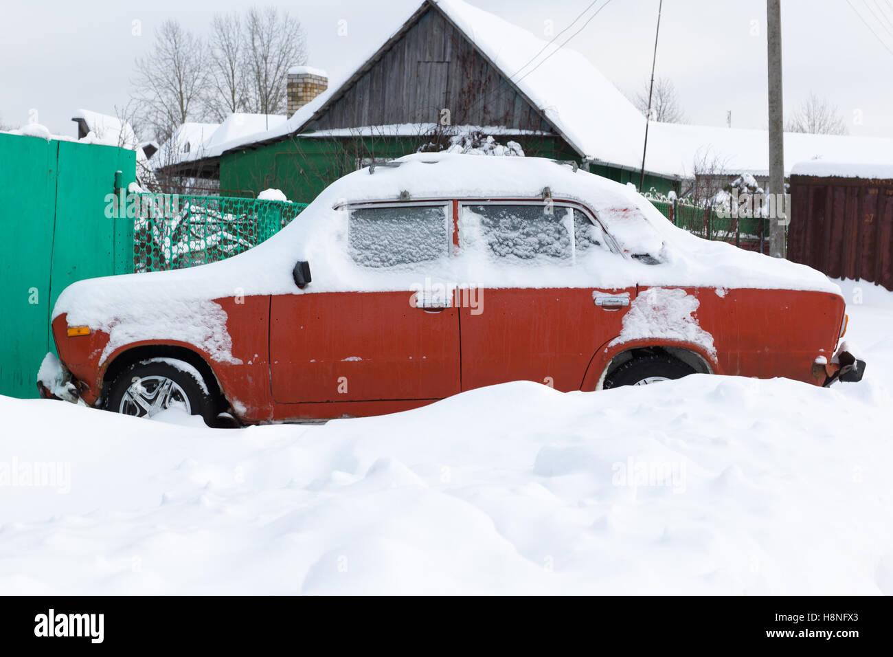 Red car on snow road hi-res stock photography and images - Alamy