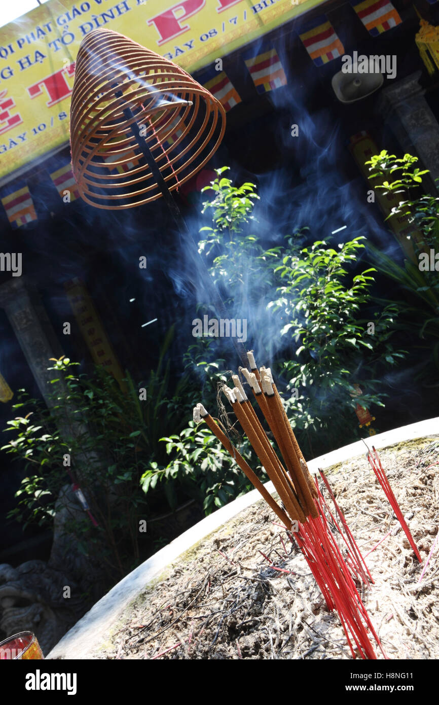 Dragon face is formed by incense's smoke at Chua Ba Da - Buddhist ...