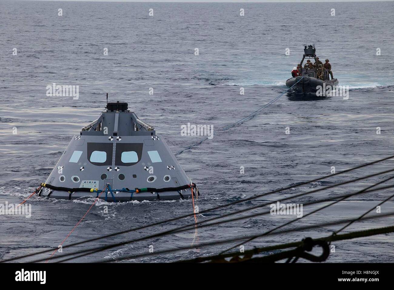 U.S. Navy sailors practice towing the NASA Orion space capsule during ...
