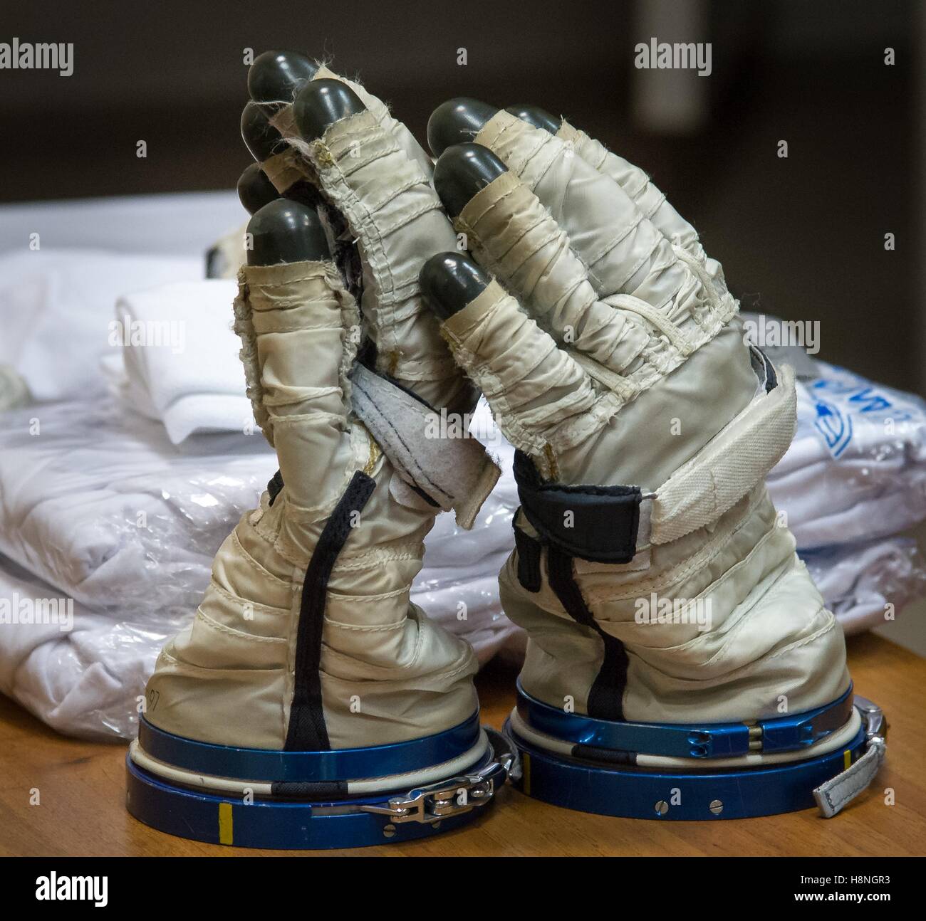A pair of Russian Sokol suit gloves sit on a table during Soyuz ...