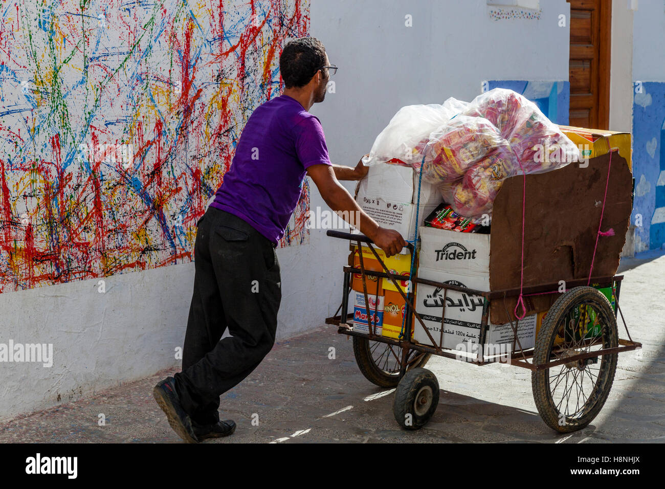 A Young Man Making Deliveries In The Medina, Asilah, Morocco Stock ...