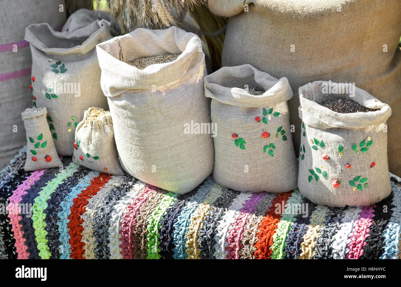 Beautifully decorated bags of grain of various crops on display for ...