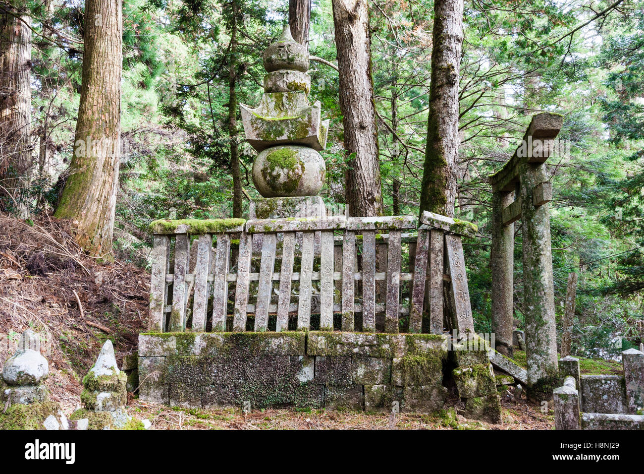 Japan, Koyasan, Okunoin ancient cemetery. Side view, stone fence around ...