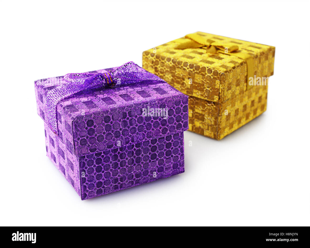 Golden and violet gift boxes isolated on white background Stock Photo ...
