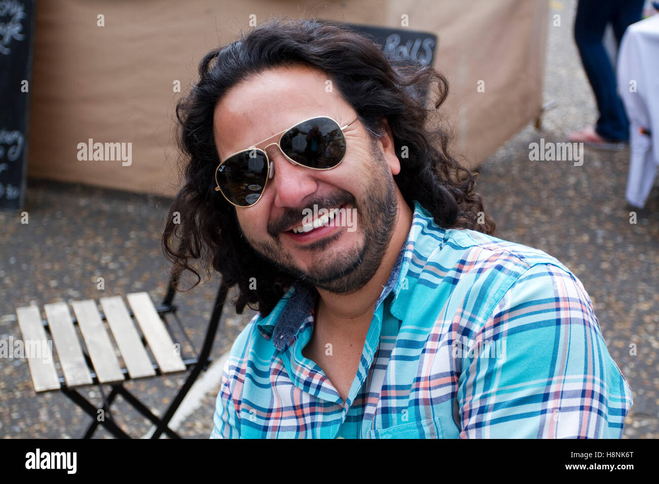 Happy smiling Argentinian man in sunglasses and colorful/colourful ...