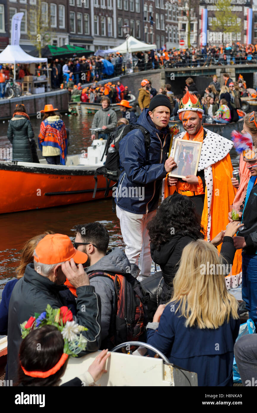 A man wearing a Royal cloak and a crown celebrating the King's birthday ...