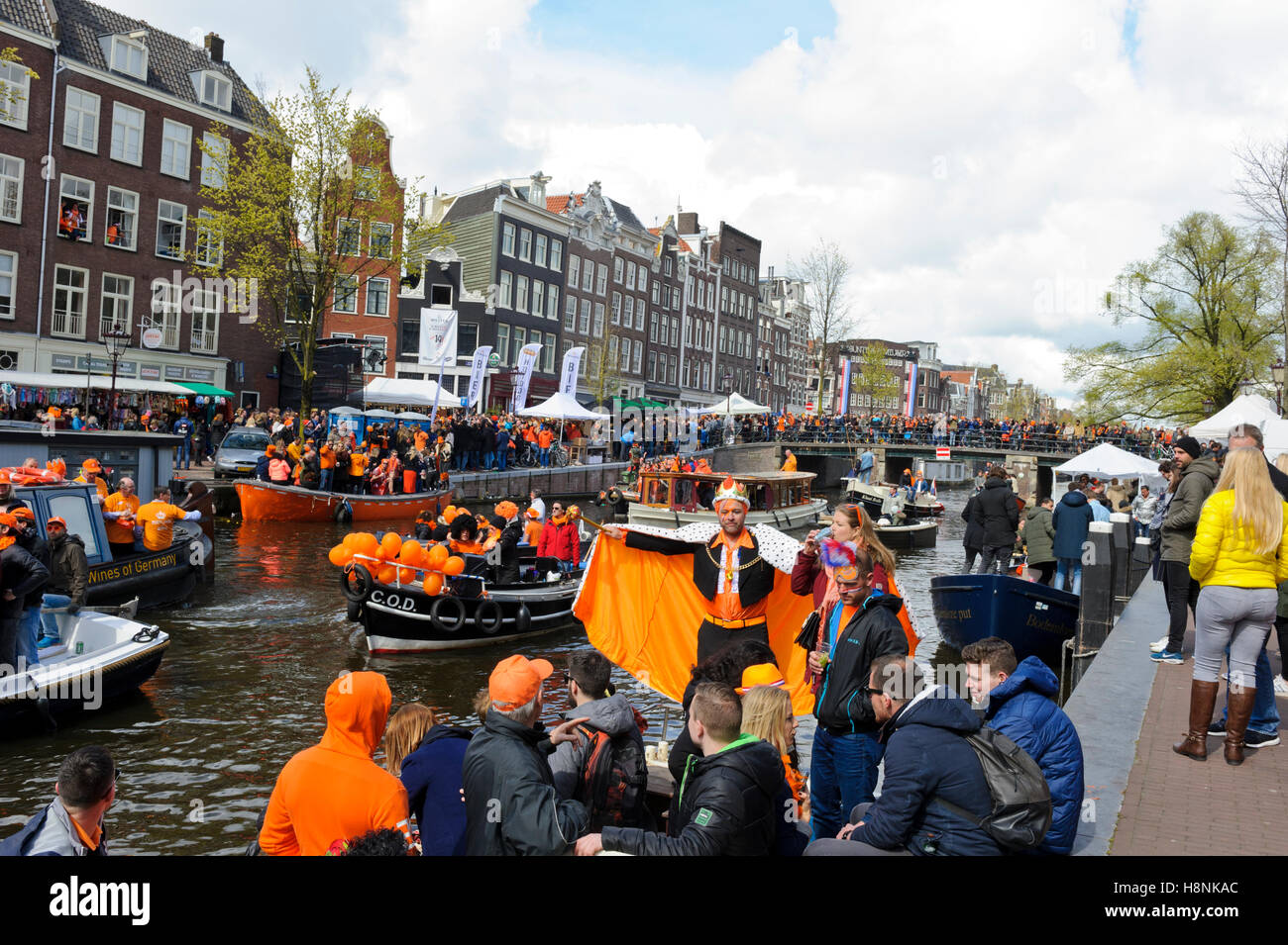 A man wearing a Royal cloak and a crown celebrating the King's birthday ...