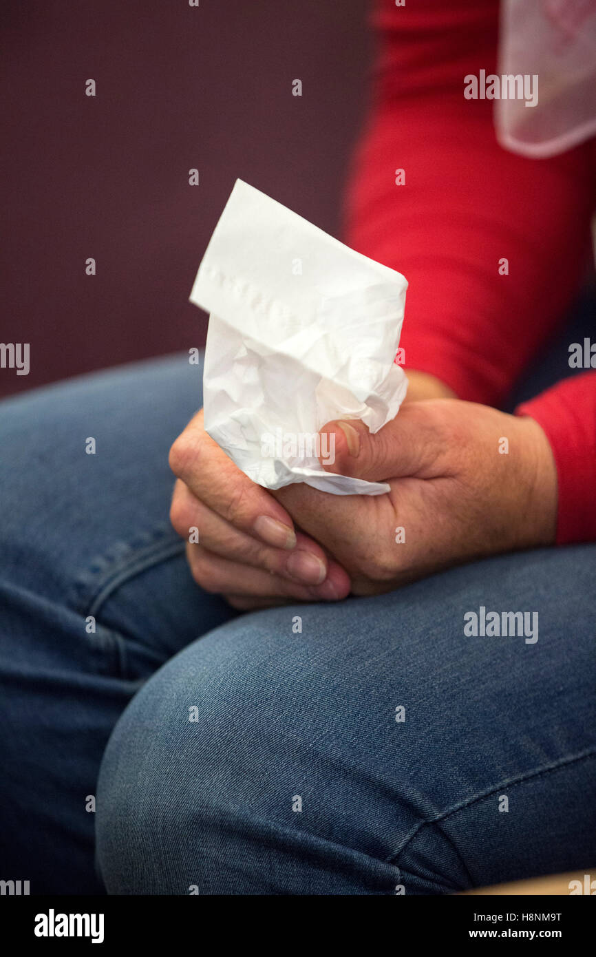 Crying woman holding tissue hi-res stock photography and images - Alamy