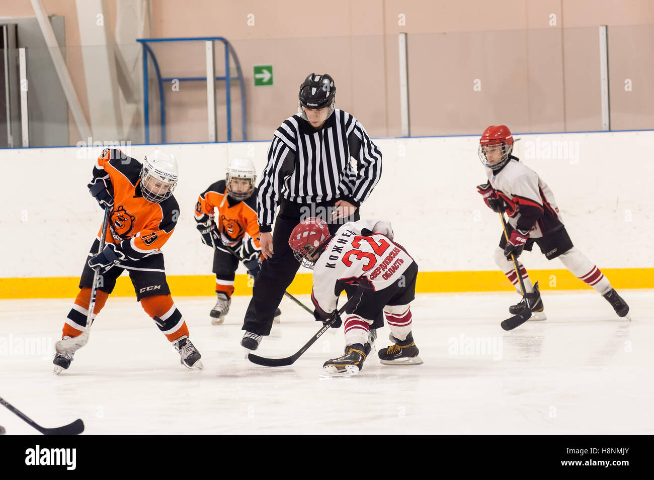Puck playing between players of ice-hockey teams Stock Photo - Alamy