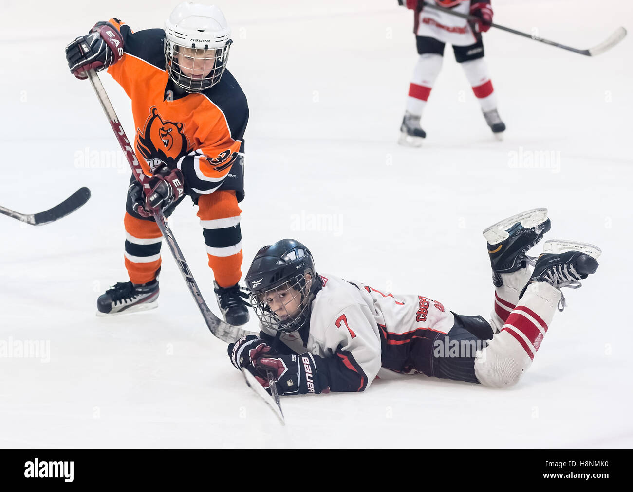 Game between children ice-hockey teams Stock Photo - Alamy