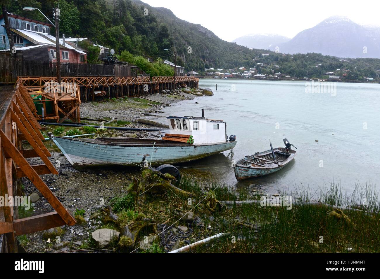 Traditional wood boardwalks in Caleta Tortel coastal village. Aysén ...