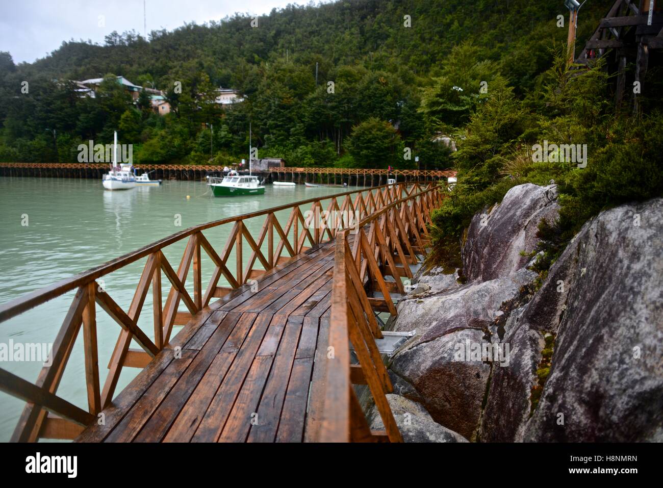 Traditional wood boardwalks in Caleta Tortel coastal village. Aysén ...