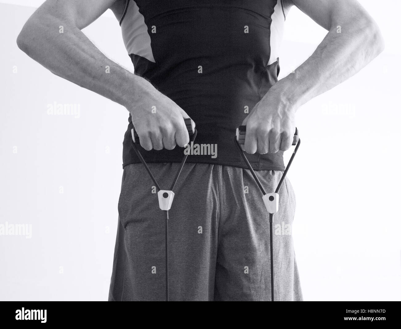 Performing exercises with resistance rope fitness Stock Photo - Alamy