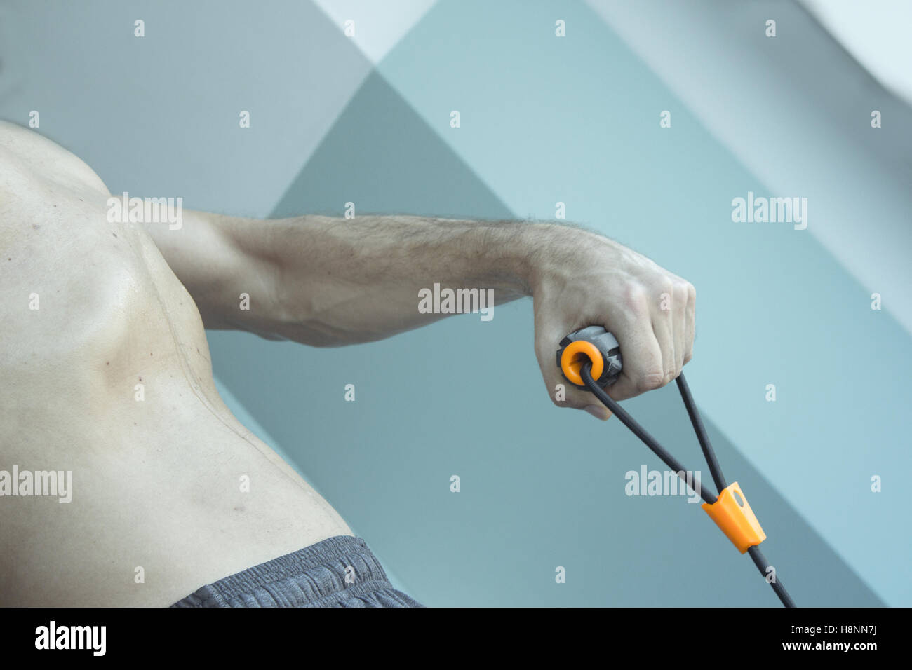 Performing exercises with resistance rope fitness Stock Photo - Alamy