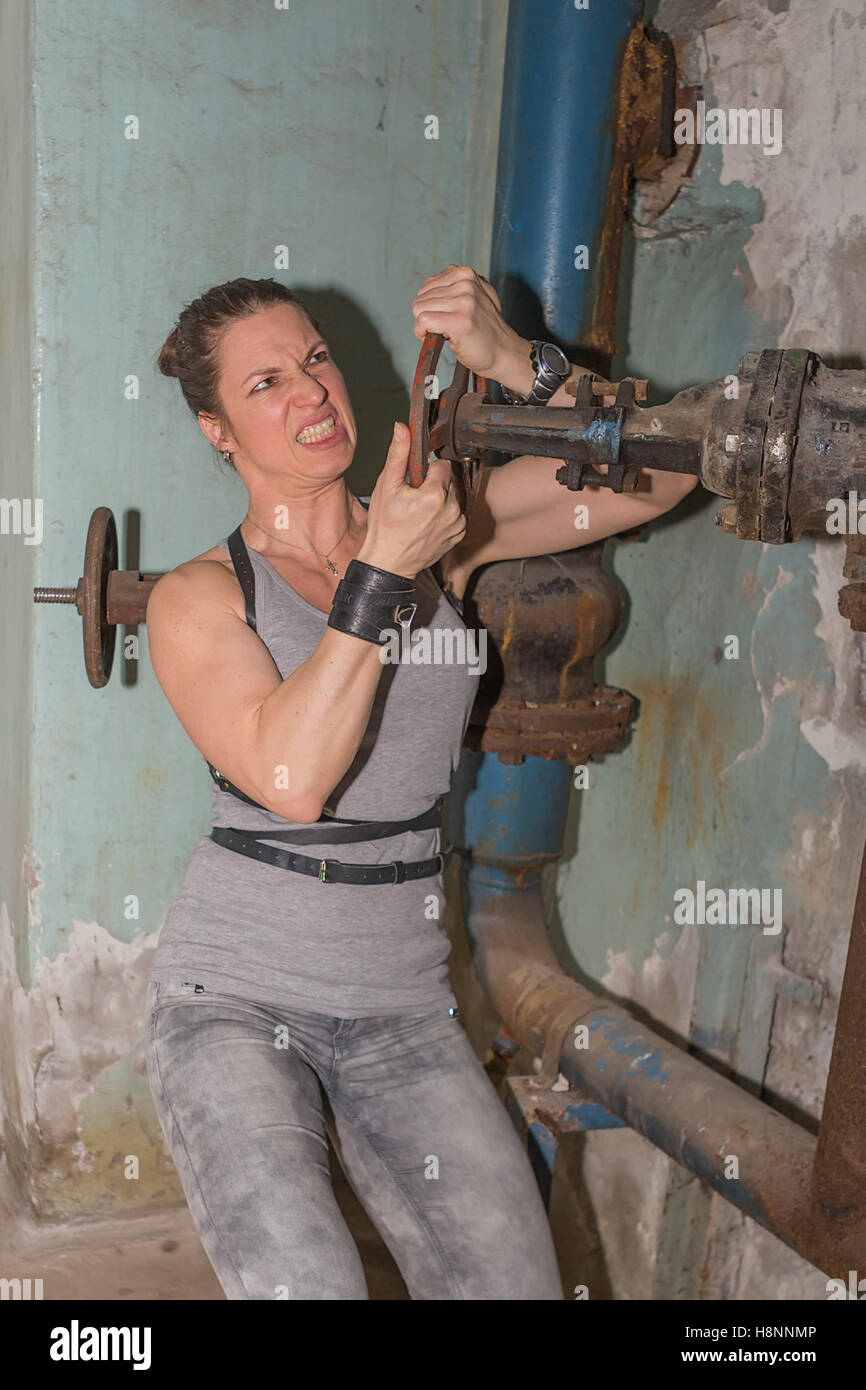 Woman working in the boiler room Stock Photo - Alamy