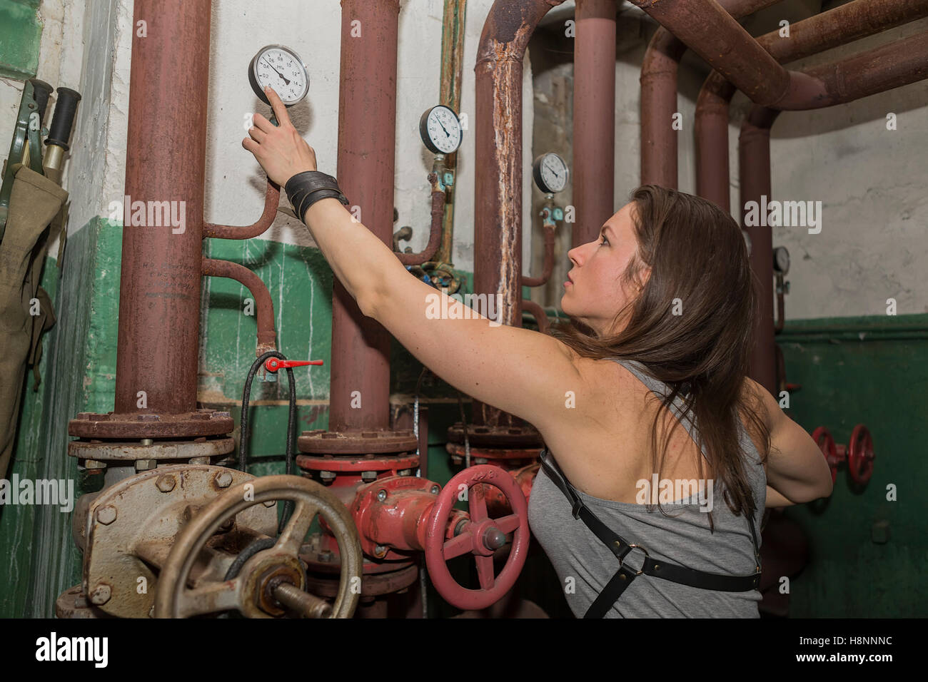 Woman working in the boiler room Stock Photo - Alamy