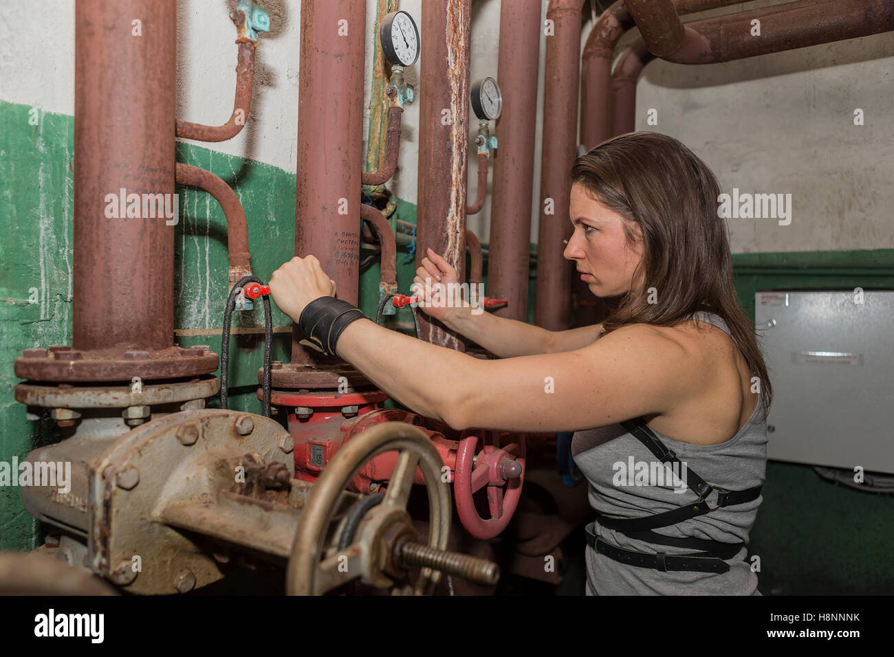 Woman working in the boiler room Stock Photo - Alamy