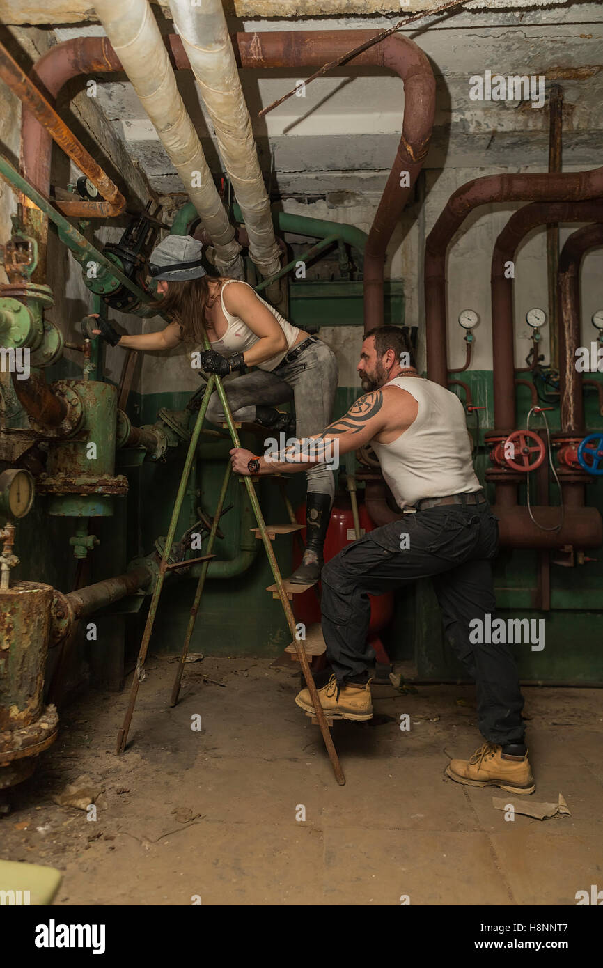 A woman and a man are working in the boiler room Stock Photo - Alamy