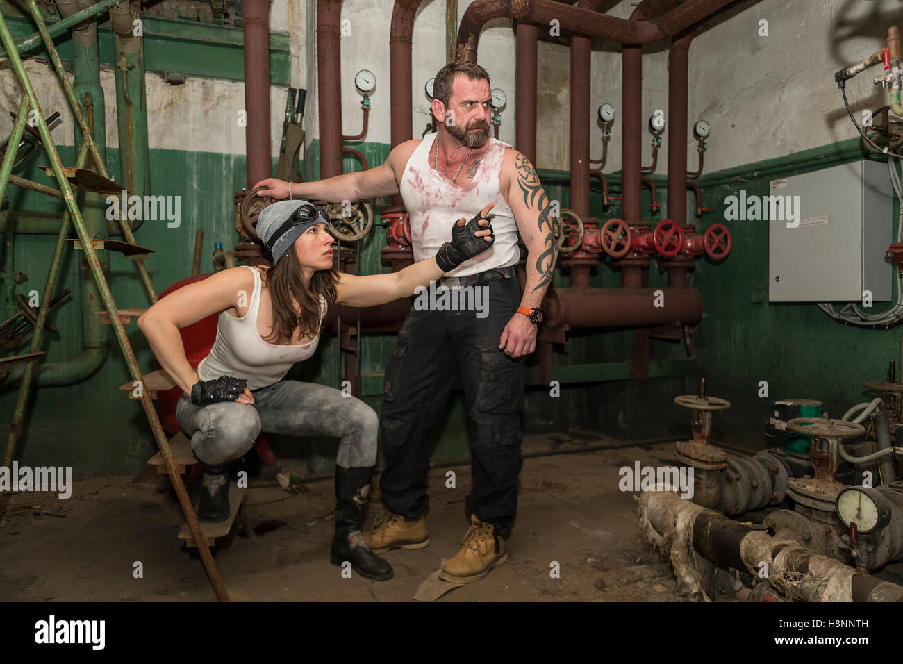 A woman and a man are working in the boiler room Stock Photo - Alamy