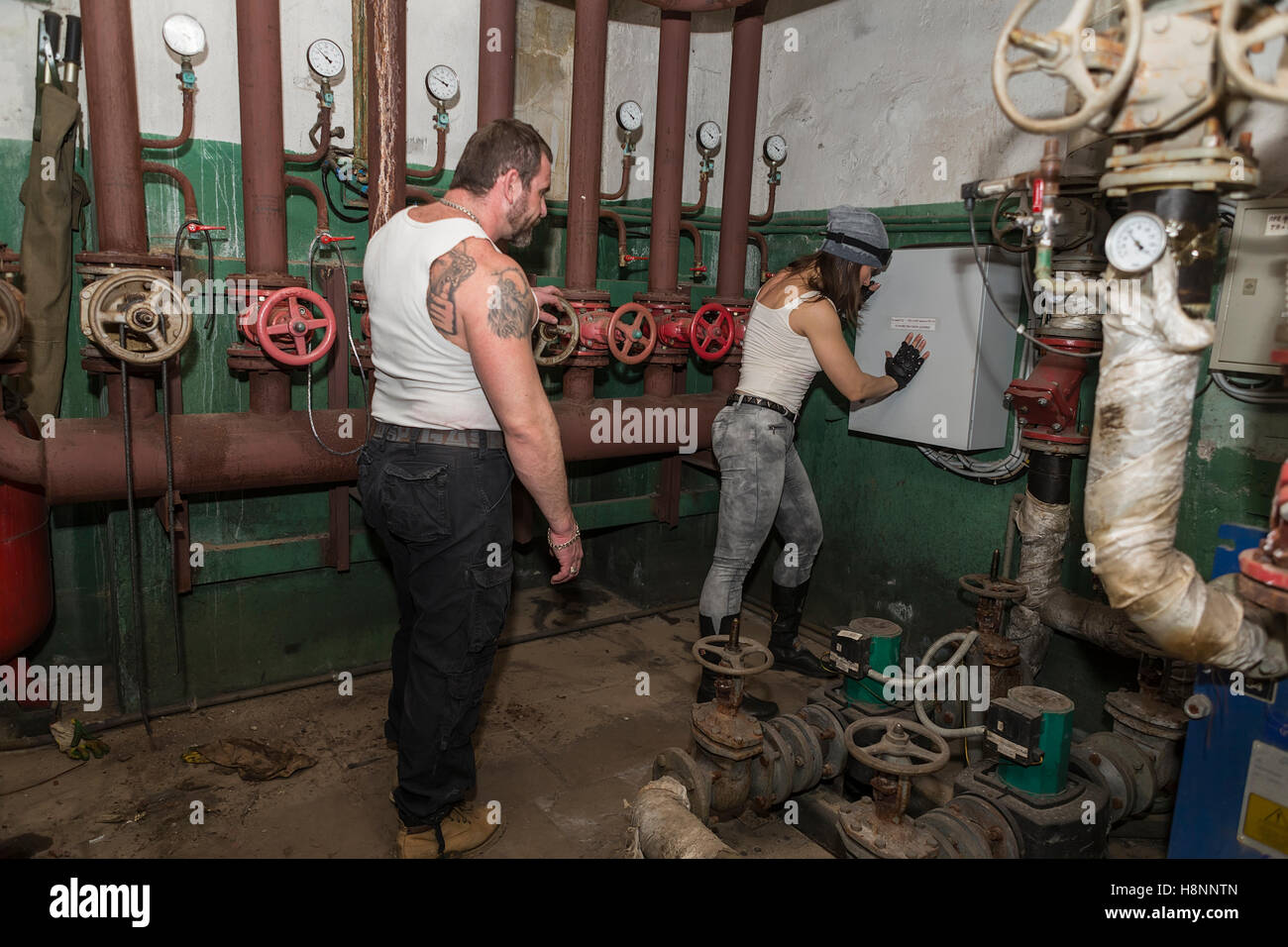A woman and a man are working in the boiler room Stock Photo - Alamy