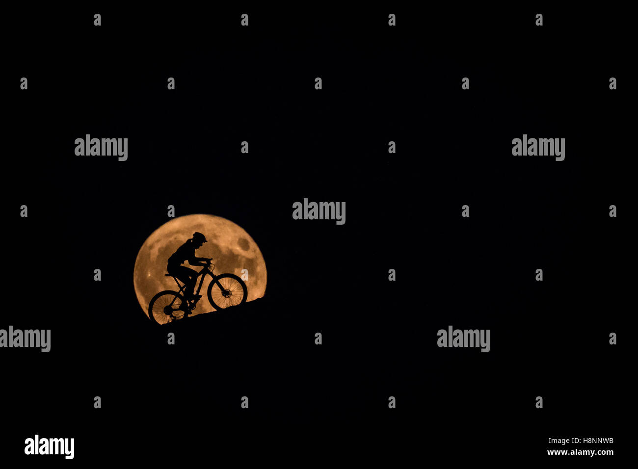Super Full Moon, Supermoon, cyclist, bike Stock Photo - Alamy