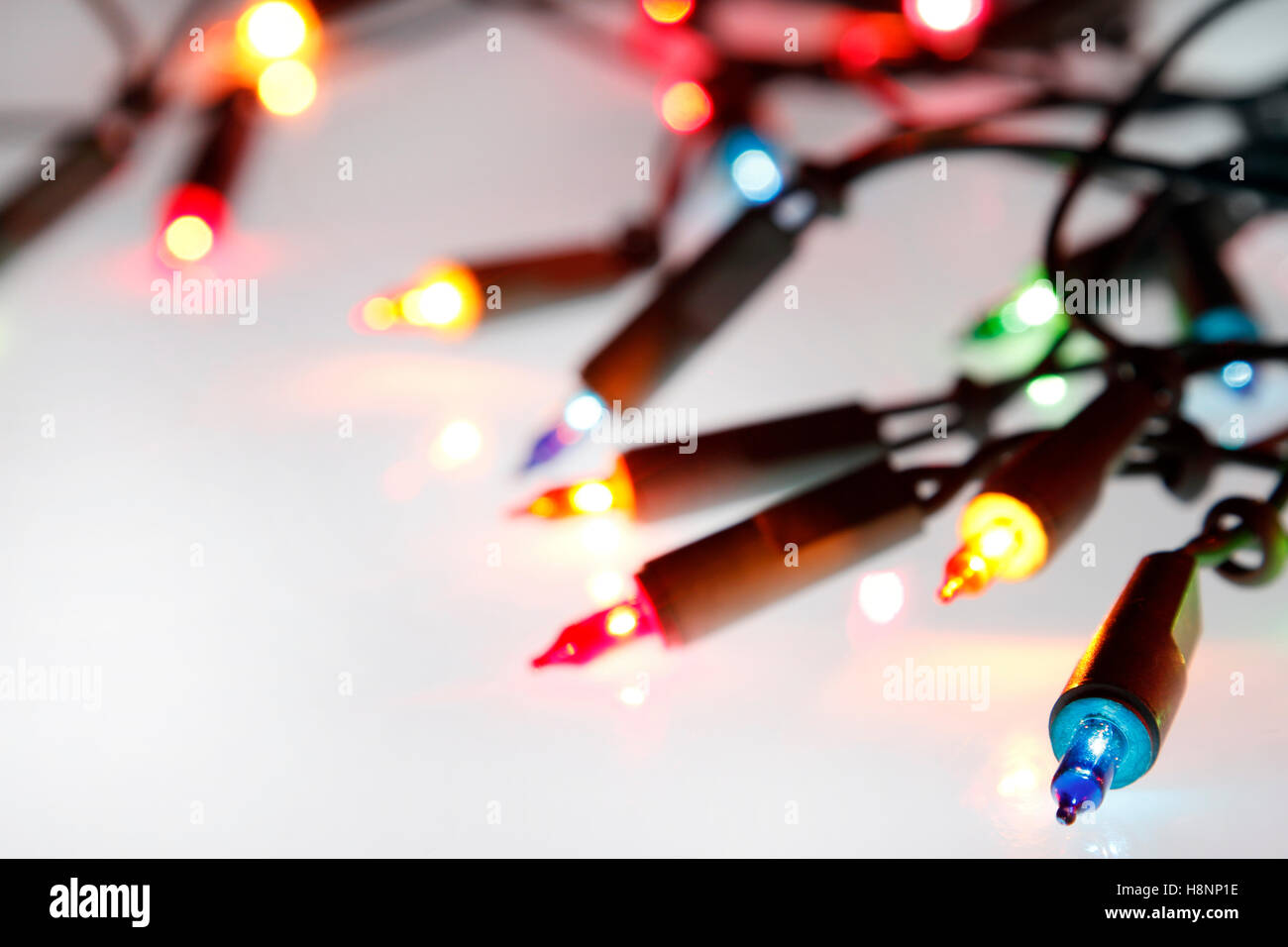 Closeup of Christmas lights glowing Stock Photo - Alamy