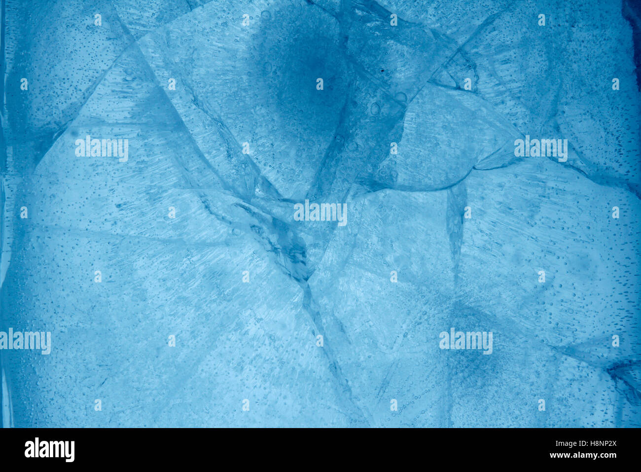 Closeup of cracked blue ice Stock Photo - Alamy