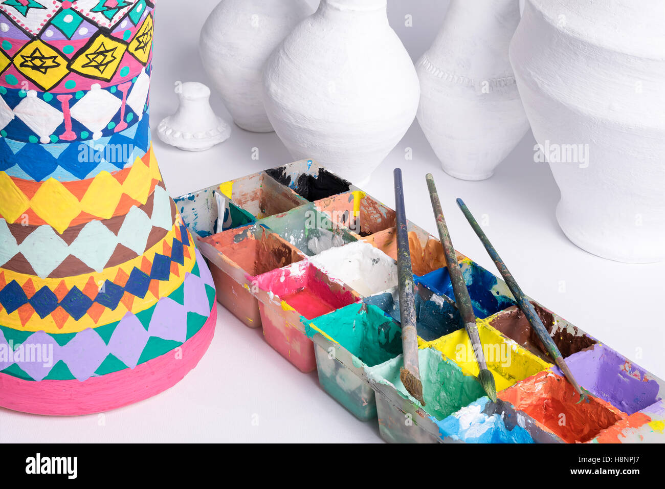 Part of a pottery painting art studio consists of color palette ...
