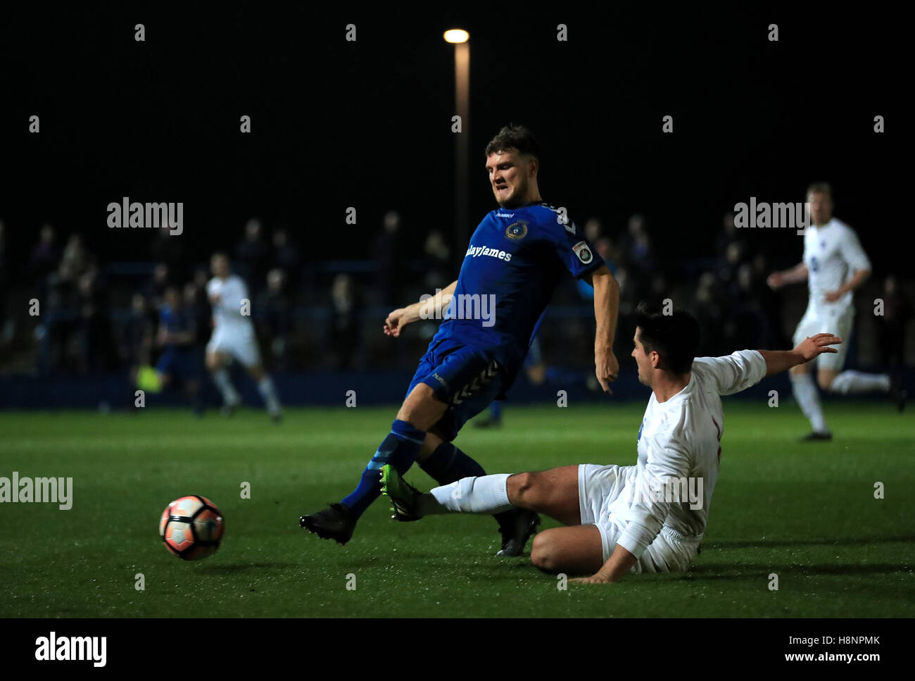 Westfield's Sam Gwynne (right) tackles Curzon Ashton's Joe Guest during ...