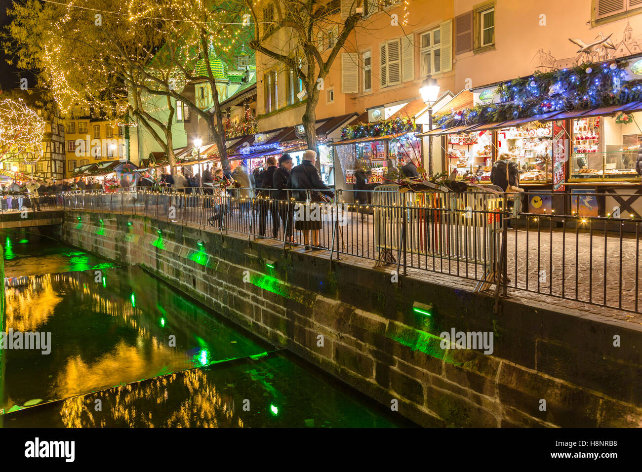 Historic Christmas market in the center of Colmar at night, wine route ...