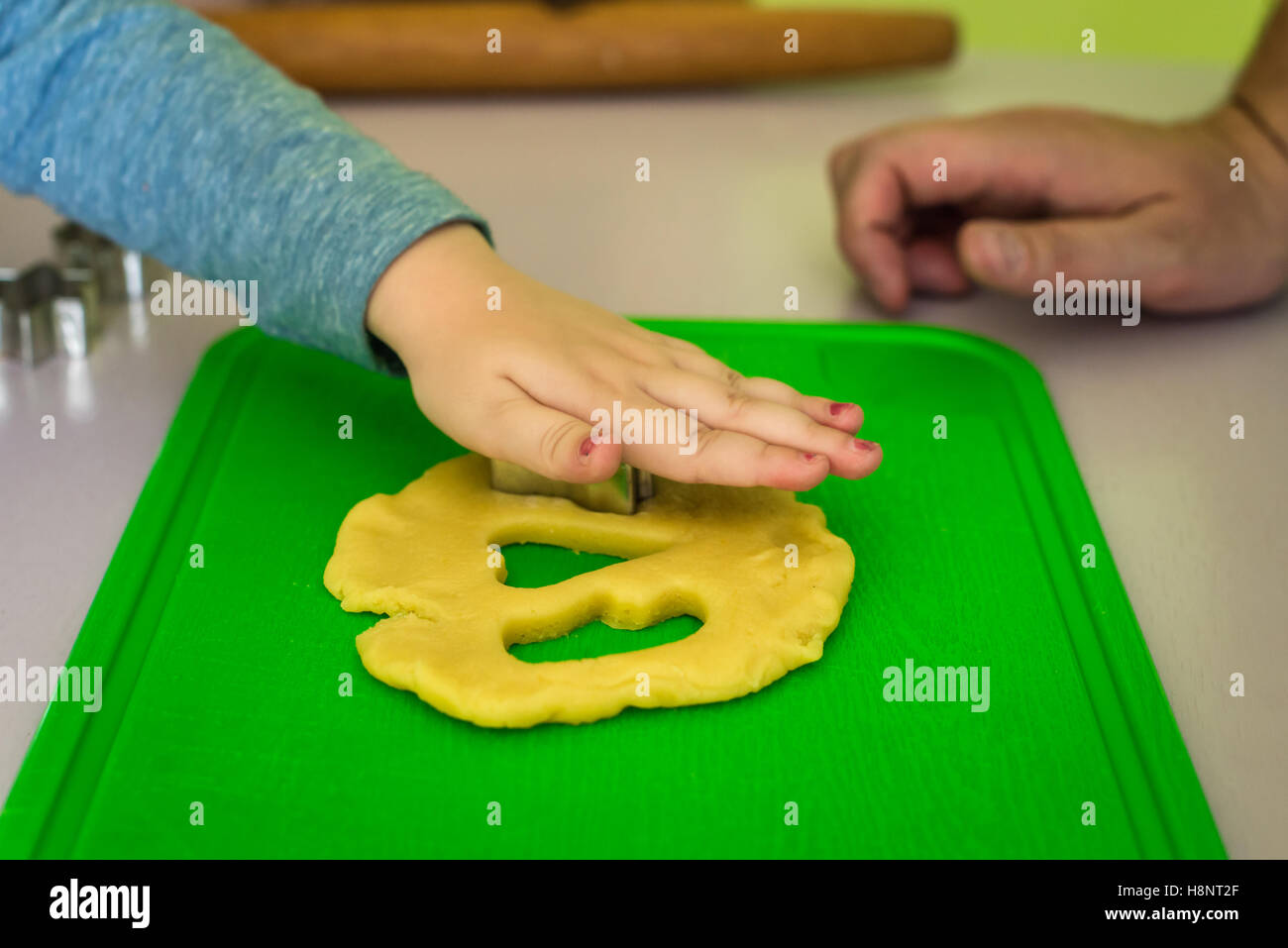 child makes dough cookie cutters Stock Photo - Alamy