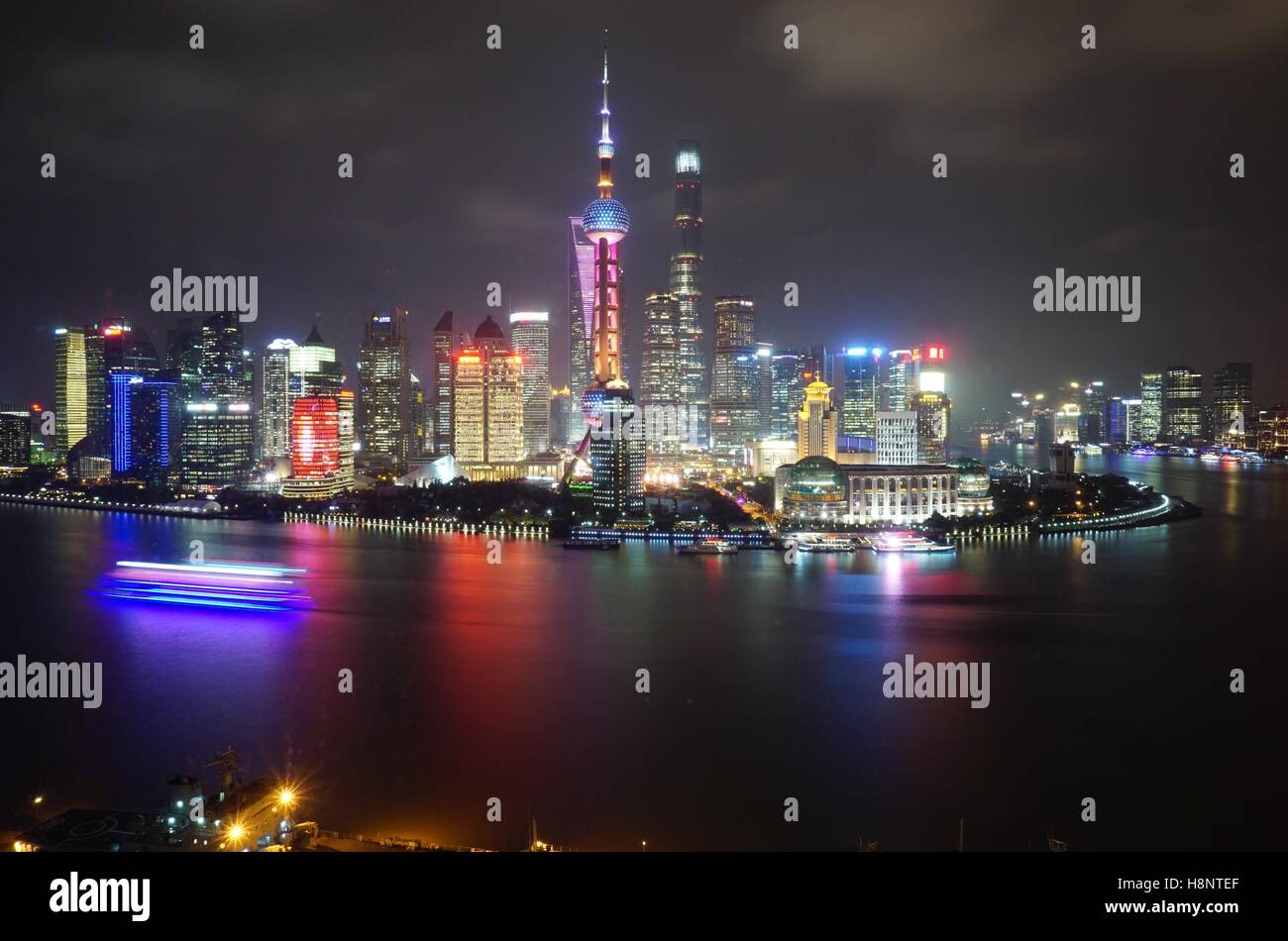 A night view of the modern Pudong skyline across the Bund in Shanghai ...