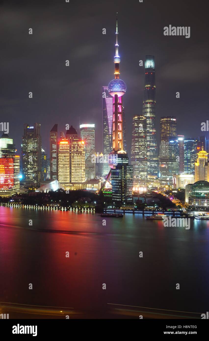 A night view of the modern Pudong skyline across the Bund in Shanghai ...