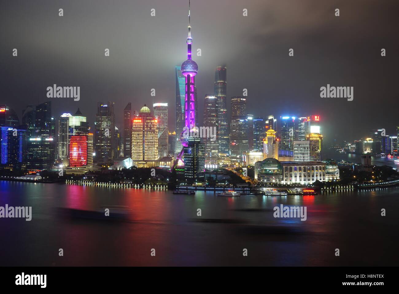 A night view of the modern Pudong skyline across the Bund in Shanghai ...