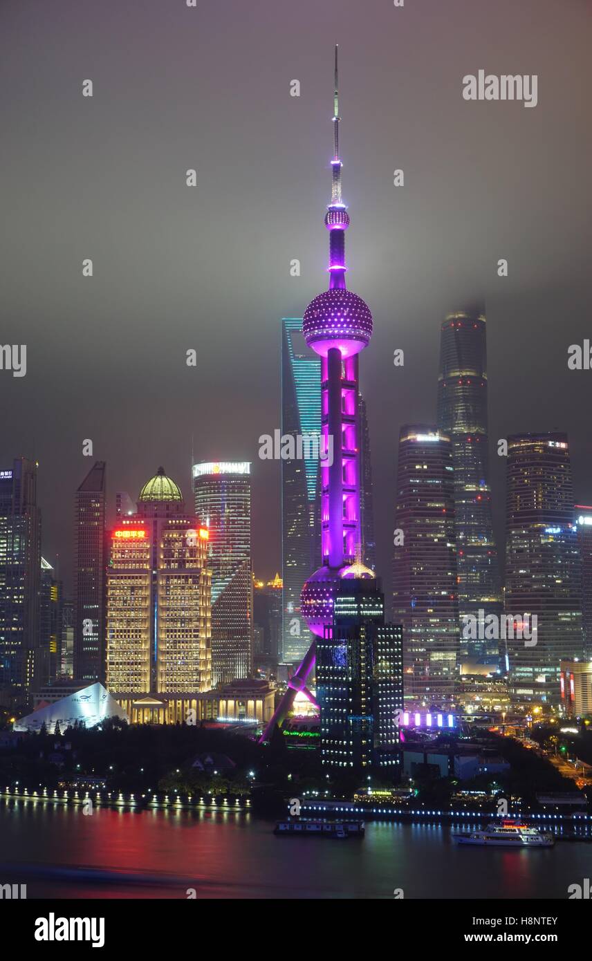 A night view of the modern Pudong skyline across the Bund in Shanghai ...