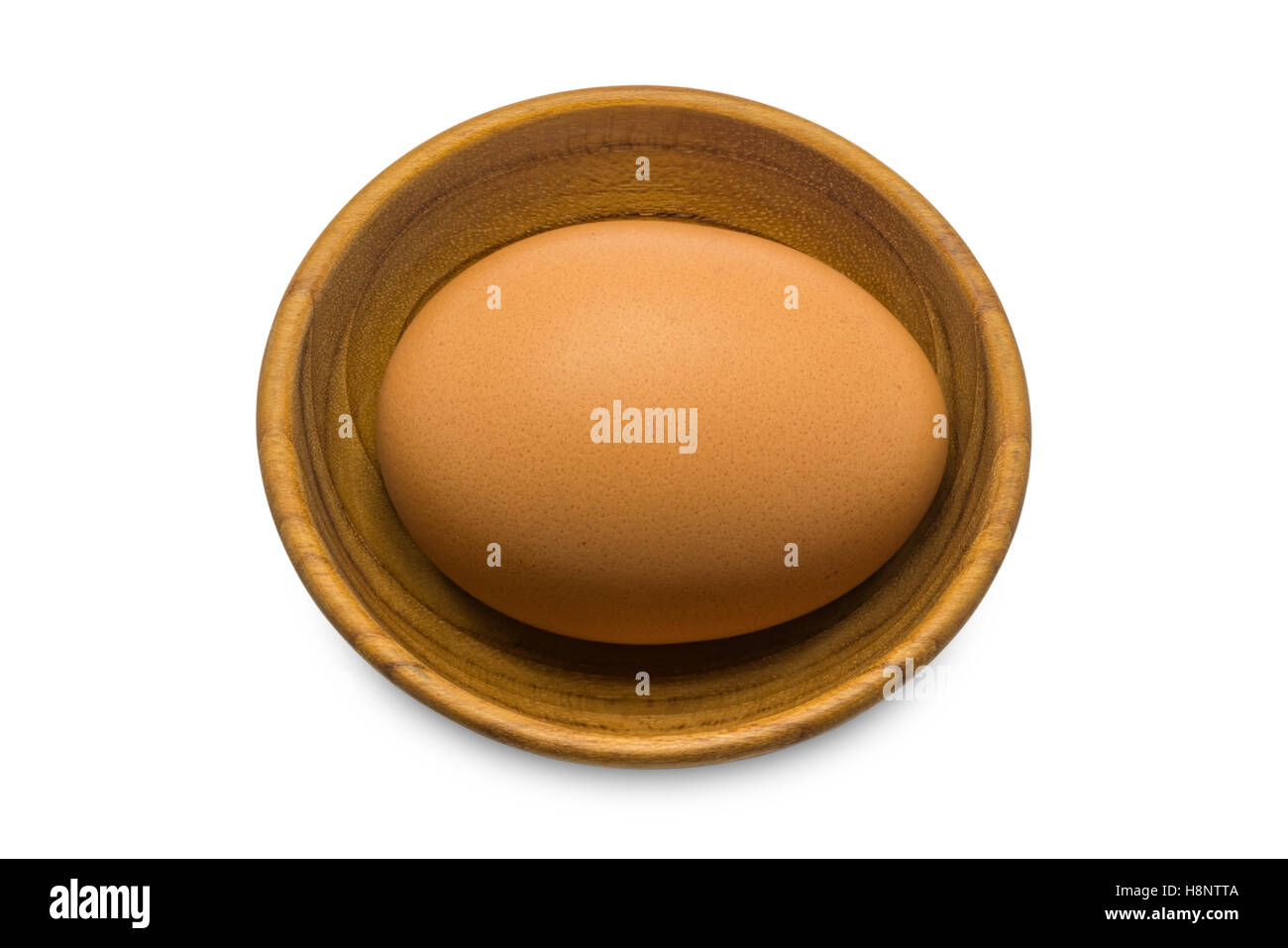 Single egg in a wooden bowl isolated on white background Stock Photo ...