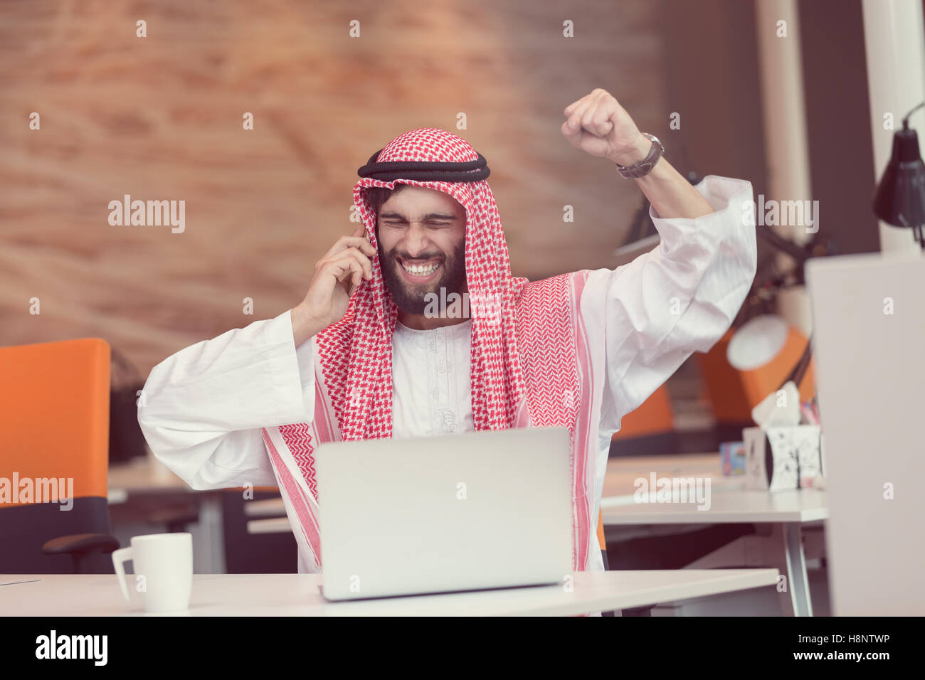 Arabian businessman working in modern startup office Stock Photo - Alamy