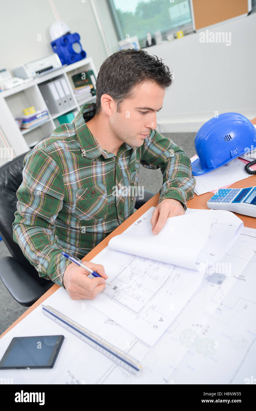 Employee jotting down notes Stock Photo - Alamy