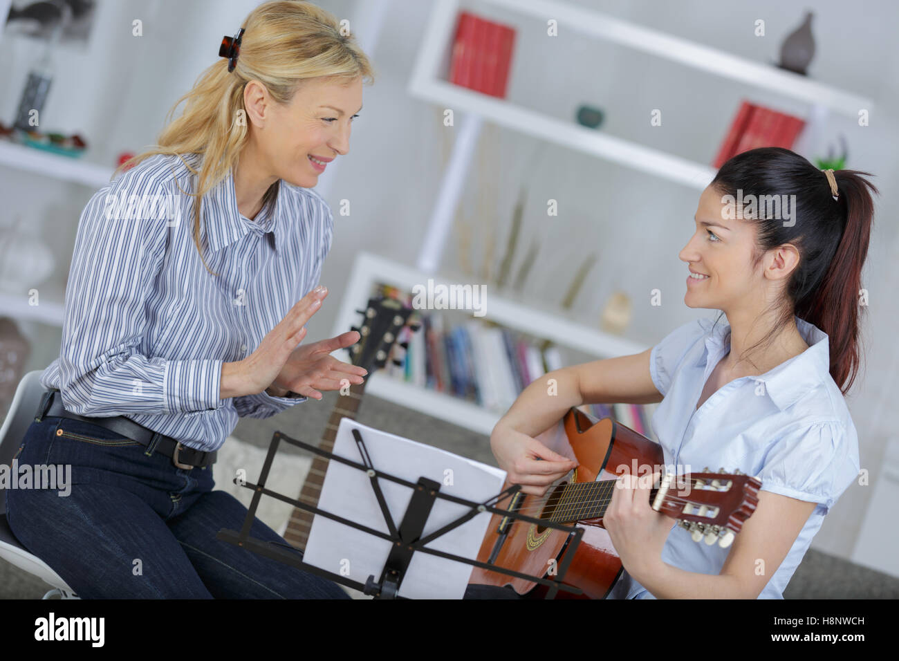 Young blonde woman teacher playing hi-res stock photography and images ...
