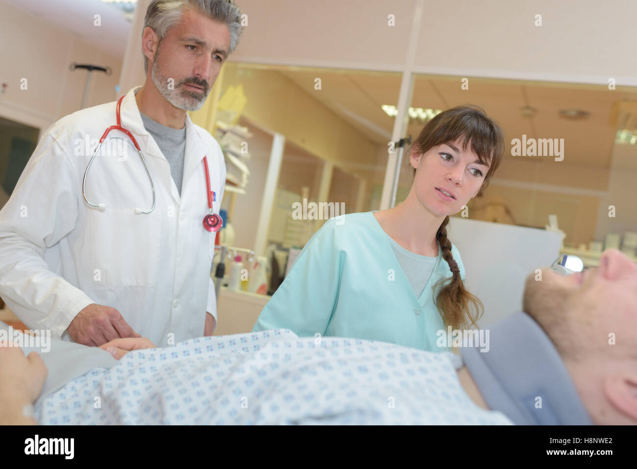 doctor and nurse interacting with each other in hospital room Stock ...