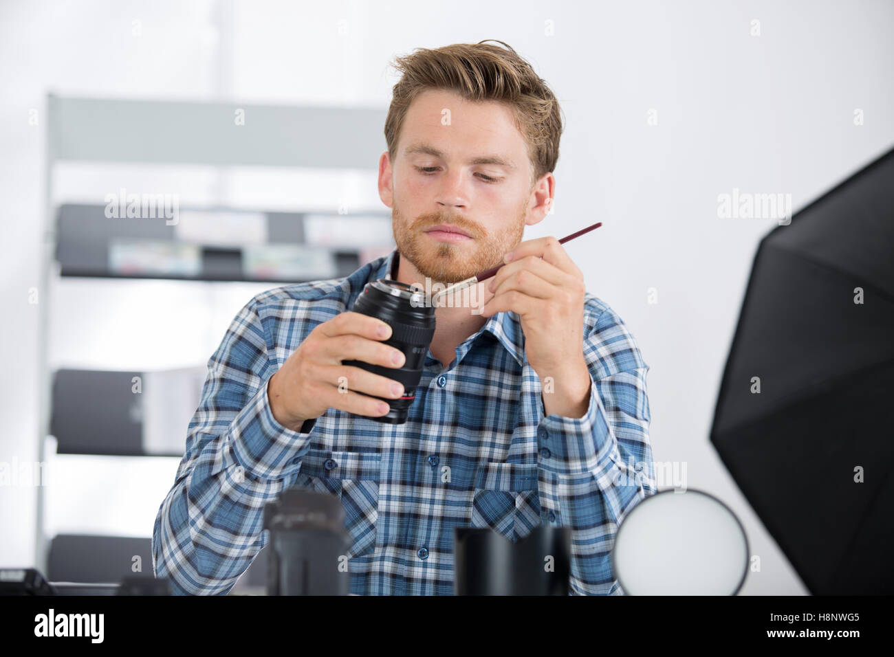 Man cleaning lens digital hi-res stock photography and images - Alamy