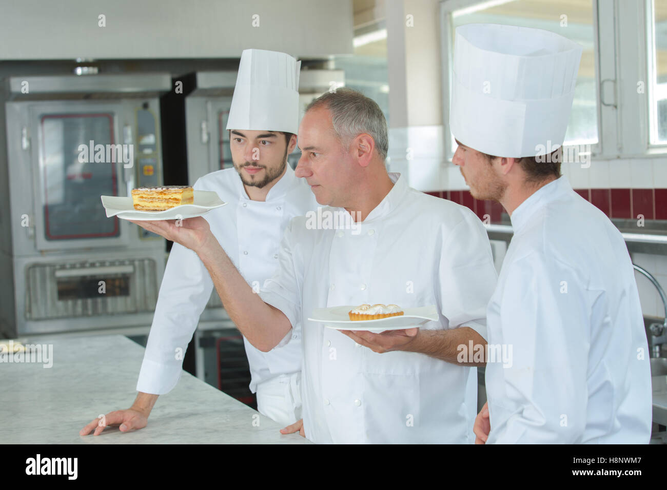 three best cooks doing their work Stock Photo - Alamy