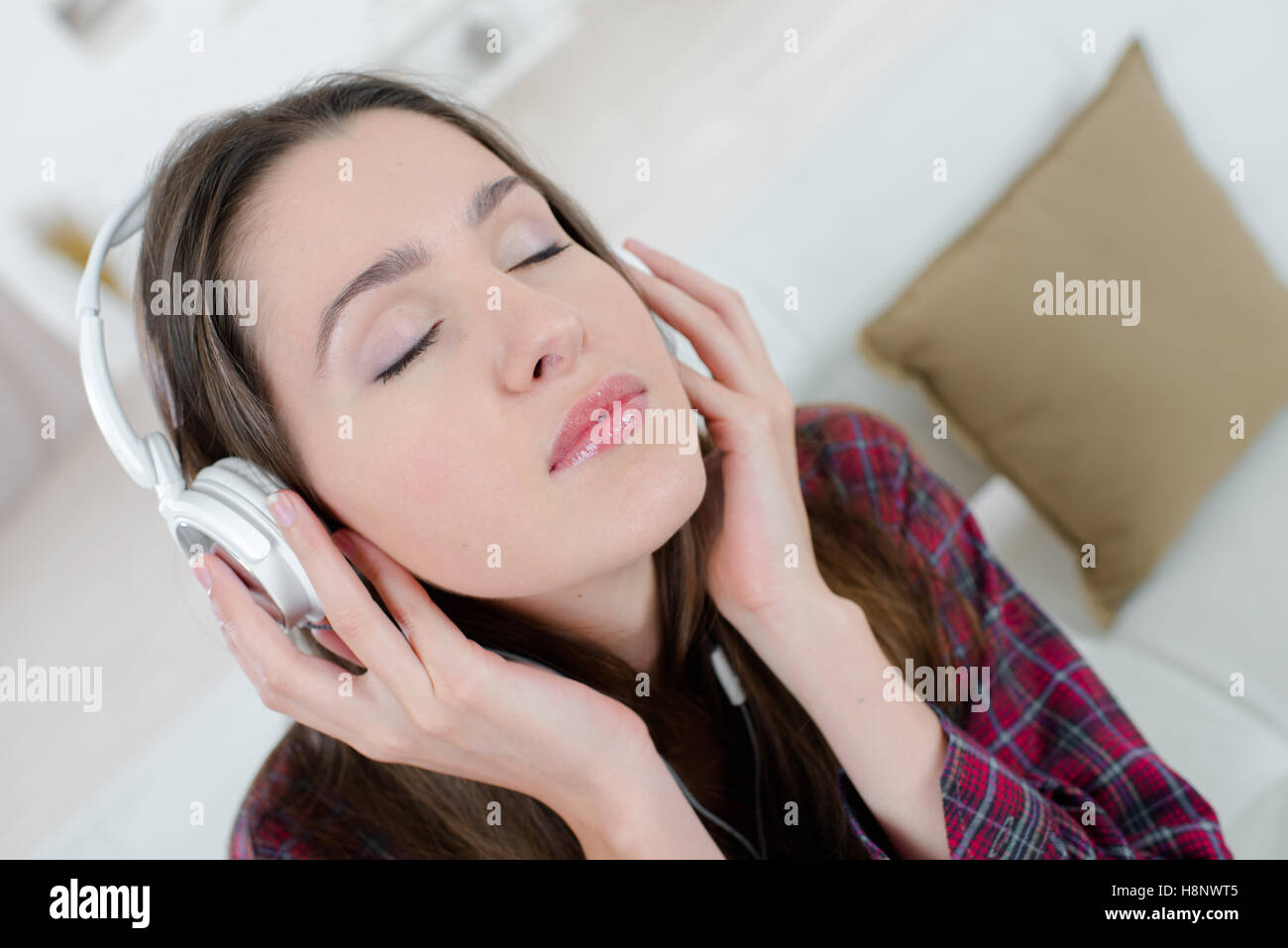 woman with headphone listening music standing at home Stock Photo - Alamy