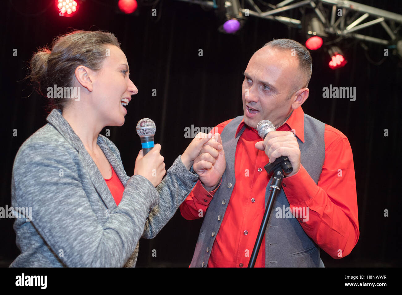 portrait of beautiful couple of professional singers on stage Stock ...